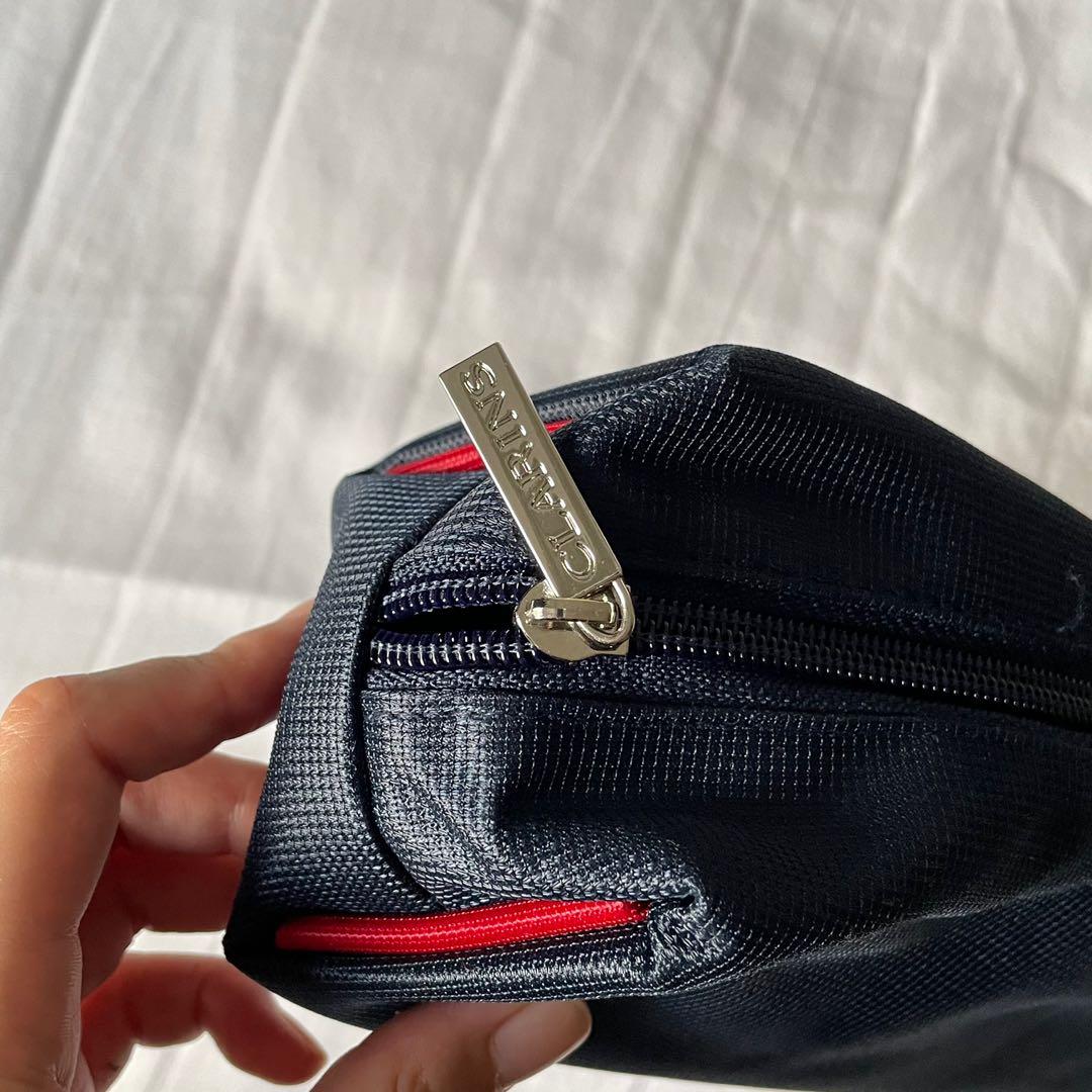 Authentic clarins pouch bag, Luxury, Bags & Wallets on Carousell