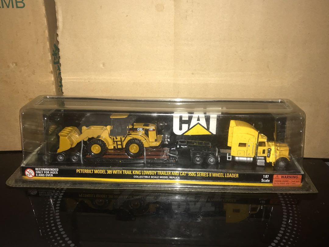 Cat caterpillar peterbilt model 389 with trail king lowboy trailer and ...