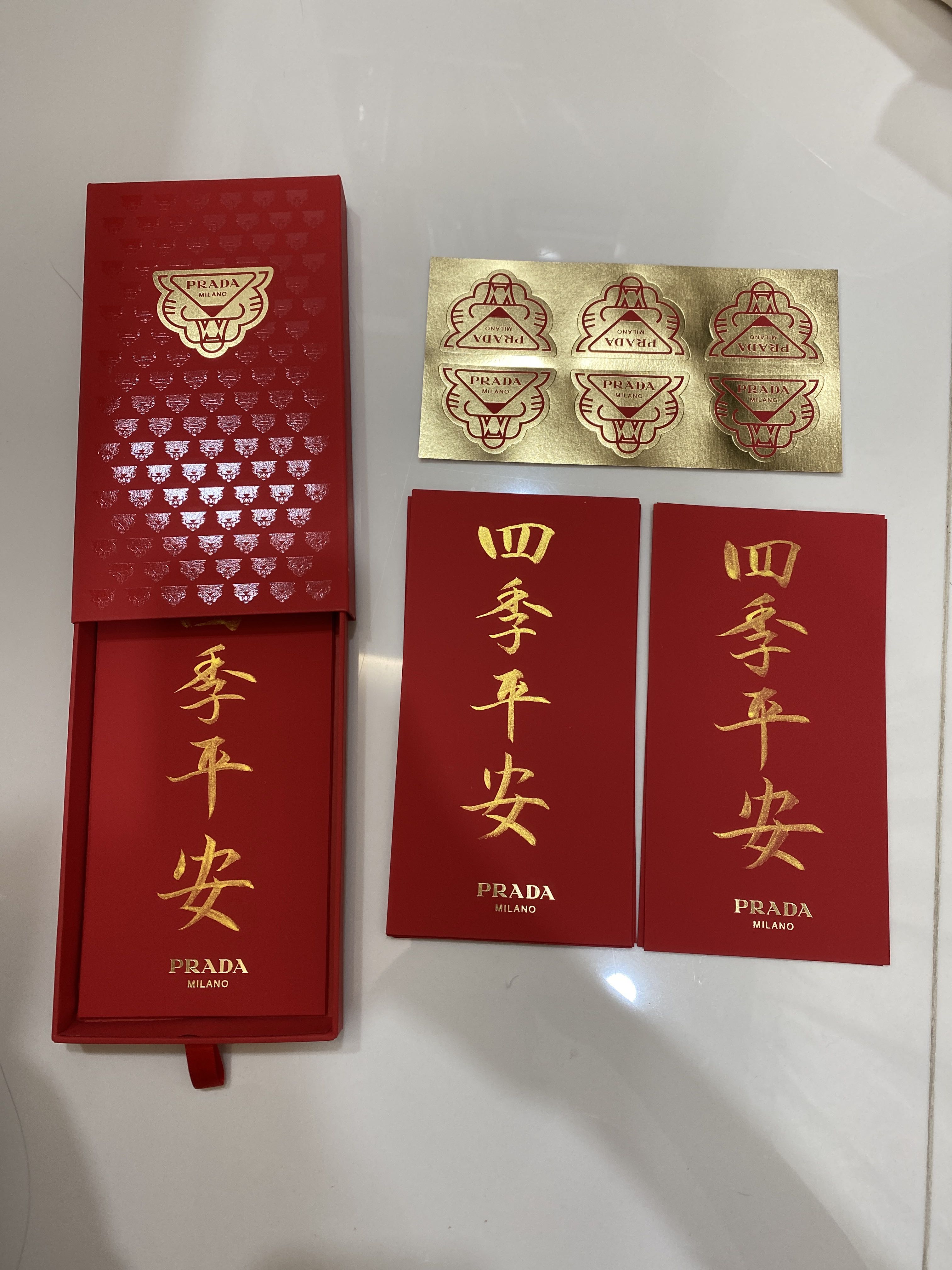 Prada 2022 red packets, Luxury, Accessories on Carousell