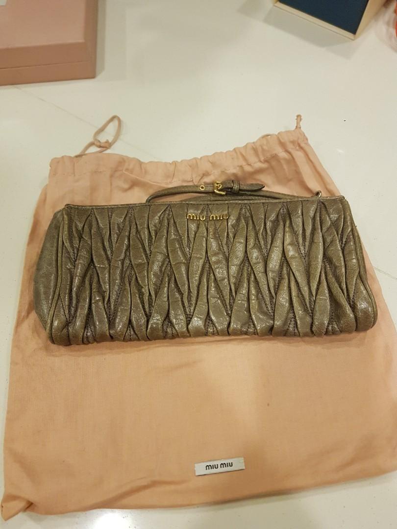 Auth Mui Mui Grey Clutch, Luxury, Bags & Wallets on Carousell