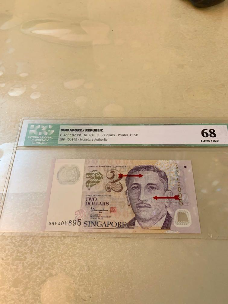 Portrait series $2 polymer with printing lines across portrait ( error ...