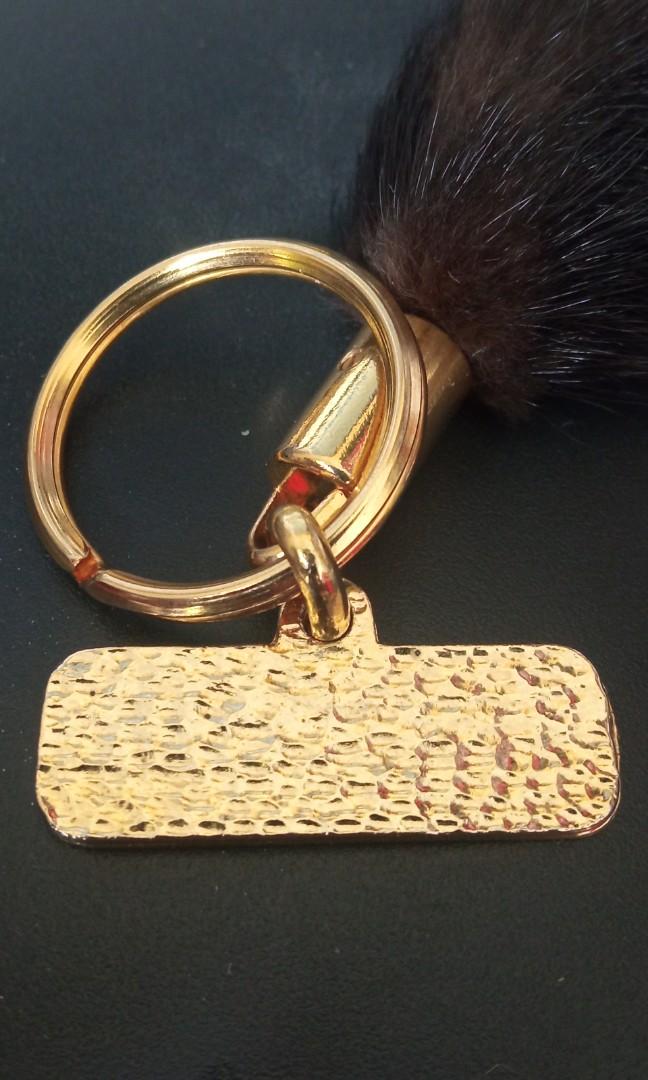 Vintage Nina Ricci Gold logo engraved plate charm with fur, Women's ...