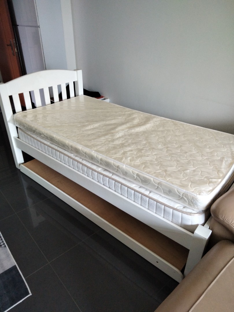Used Single size bed frame with bottom roller bed, comes with 2 single ...
