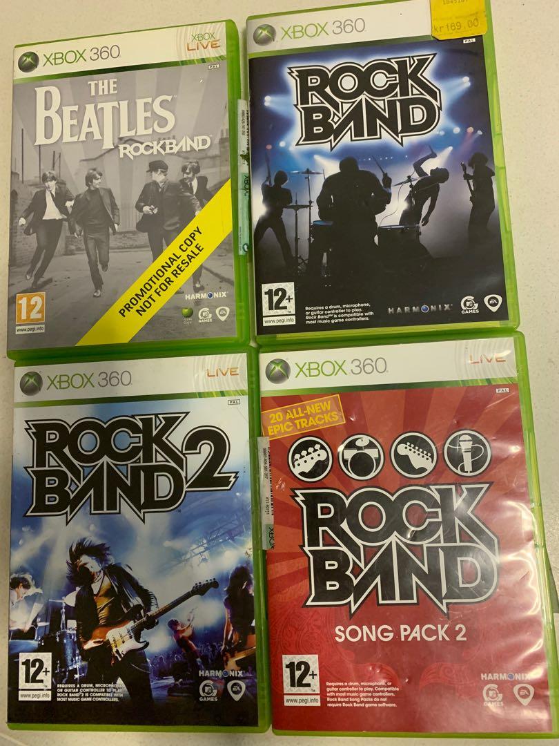 Rock Band set. Guitar, drums, drumsticks, microphone, 4 Rockband games ...