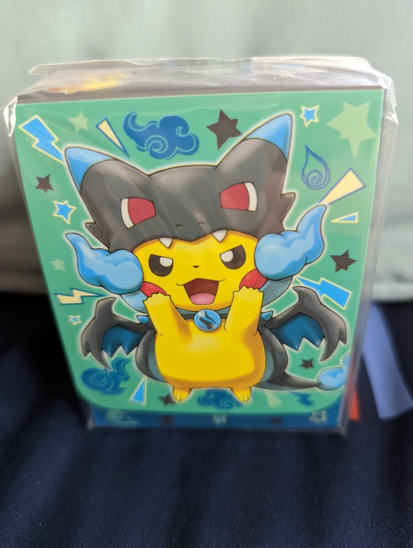Pokemon Pikachu Poncho wearing Charizard Y/ Chariard X deck box ...