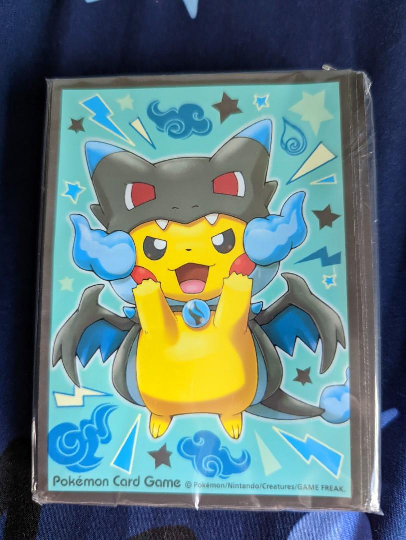 Pokemon Pikachu Poncho wearing Mega Charizard X card sleeves, Hobbies ...
