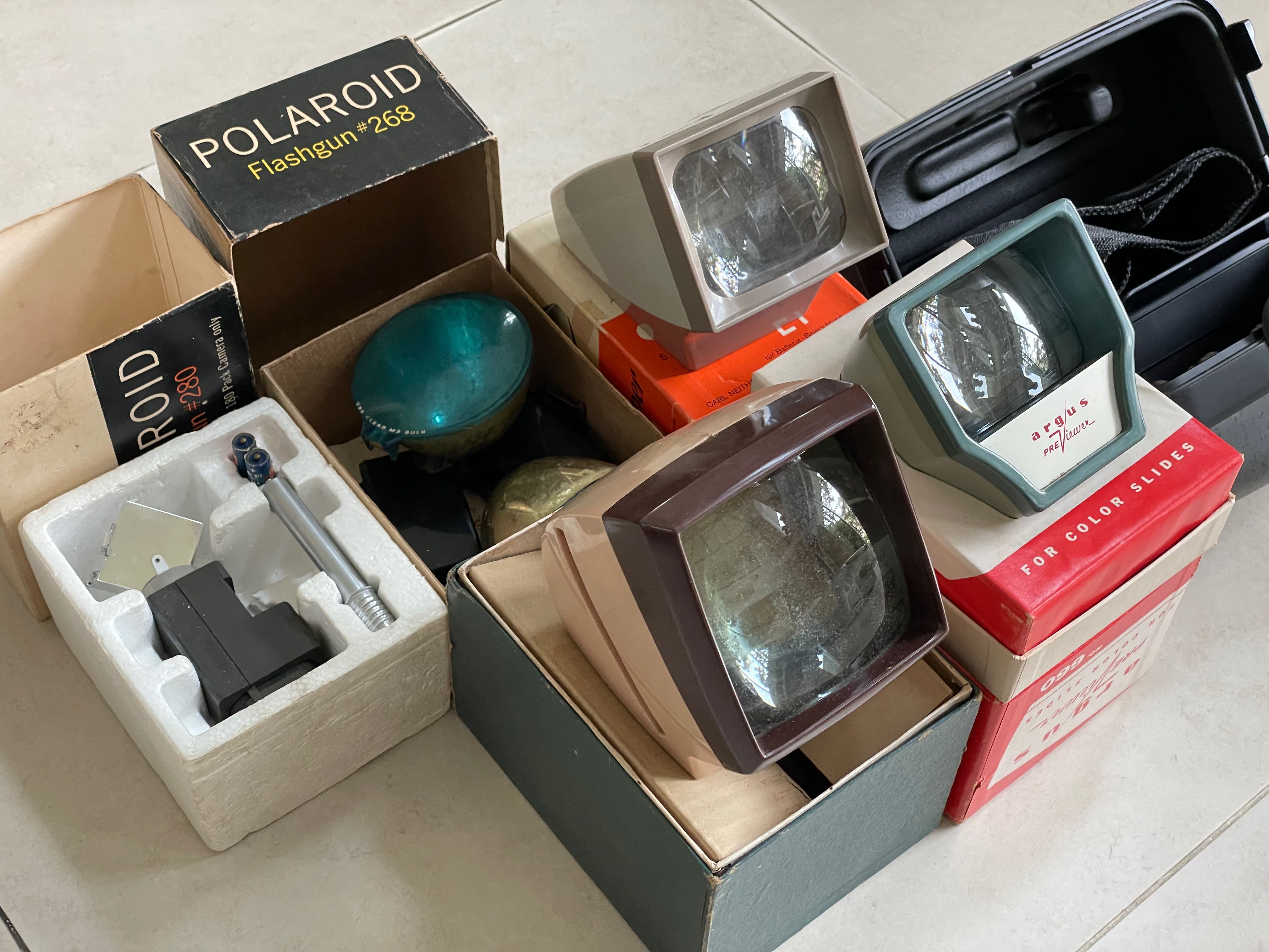 Slide viewers and polaroid flash guns, Photography, Cameras on Carousell