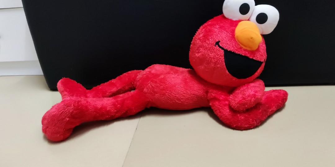 Elmo plush laying down, Babies & Kids, Infant Playtime on Carousell