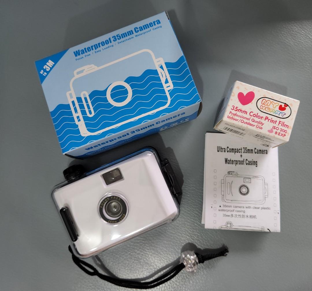 Camera with clear plastic waterproof casing, Photography, Cameras on ...