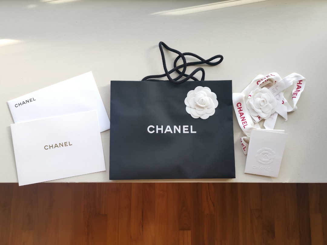 Chanel paper bag with flower, Women's Fashion, Bags & Wallets, Shoulder ...