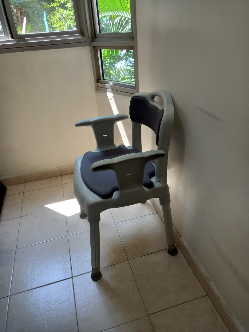 Stable seating chair with arm rests doubling as an instant commode ...