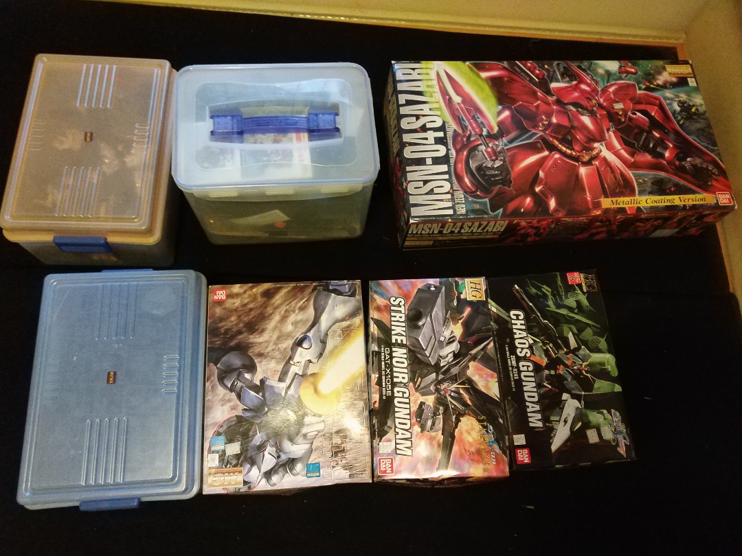 Multiple boxes of random toys / action figures / model plus parts ...