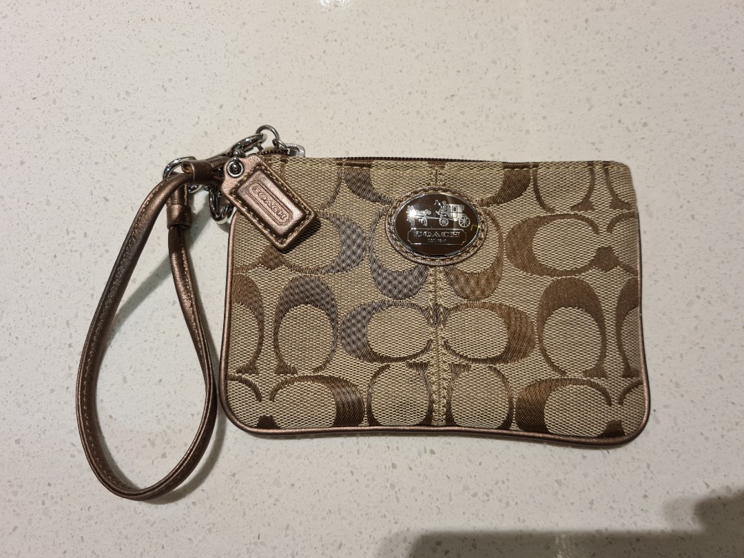 Coach Wrislet, Women's Fashion, Bags & Wallets, Clutches on Carousell