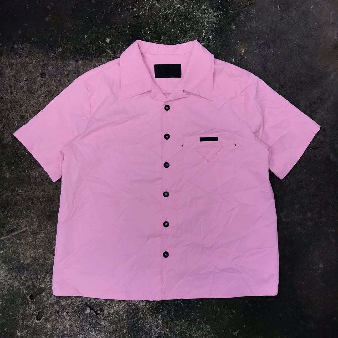 Prada buttons down polo, Luxury, Apparel on Carousell