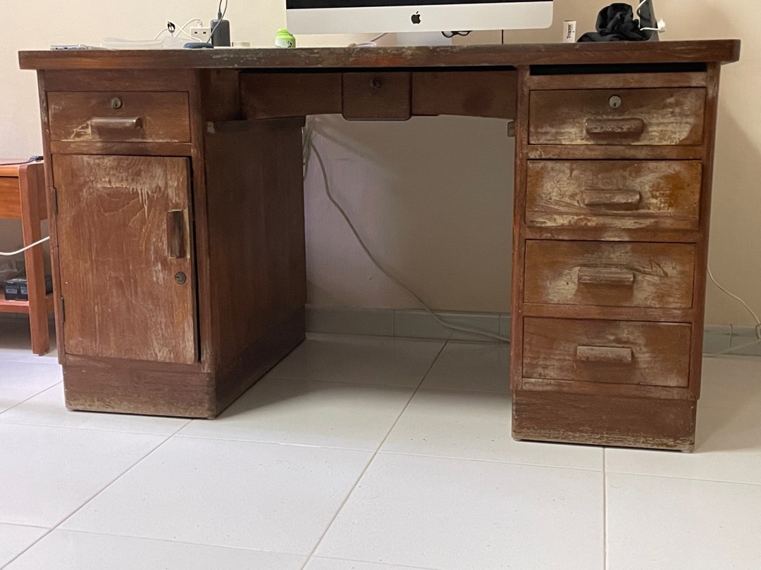 *Price negotiable* Well used teak study table with 6 drawers ...