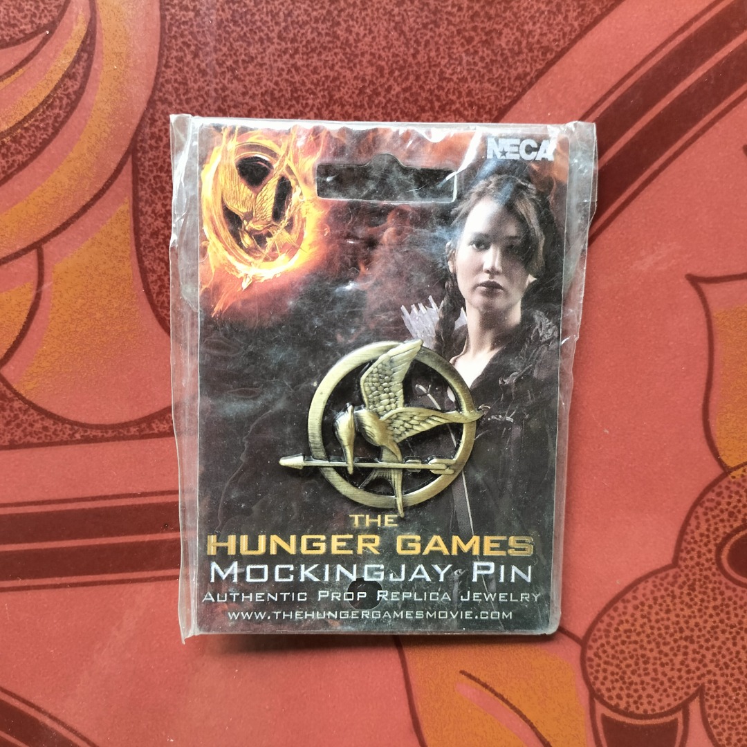 The Hunger Games Pin, Hobbies & Toys, Memorabilia & Collectibles, Fan ...