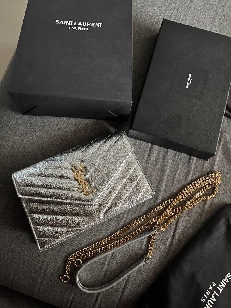 Ysl silver clutch with gold hardware strap, Luxury, Bags & Wallets on ...