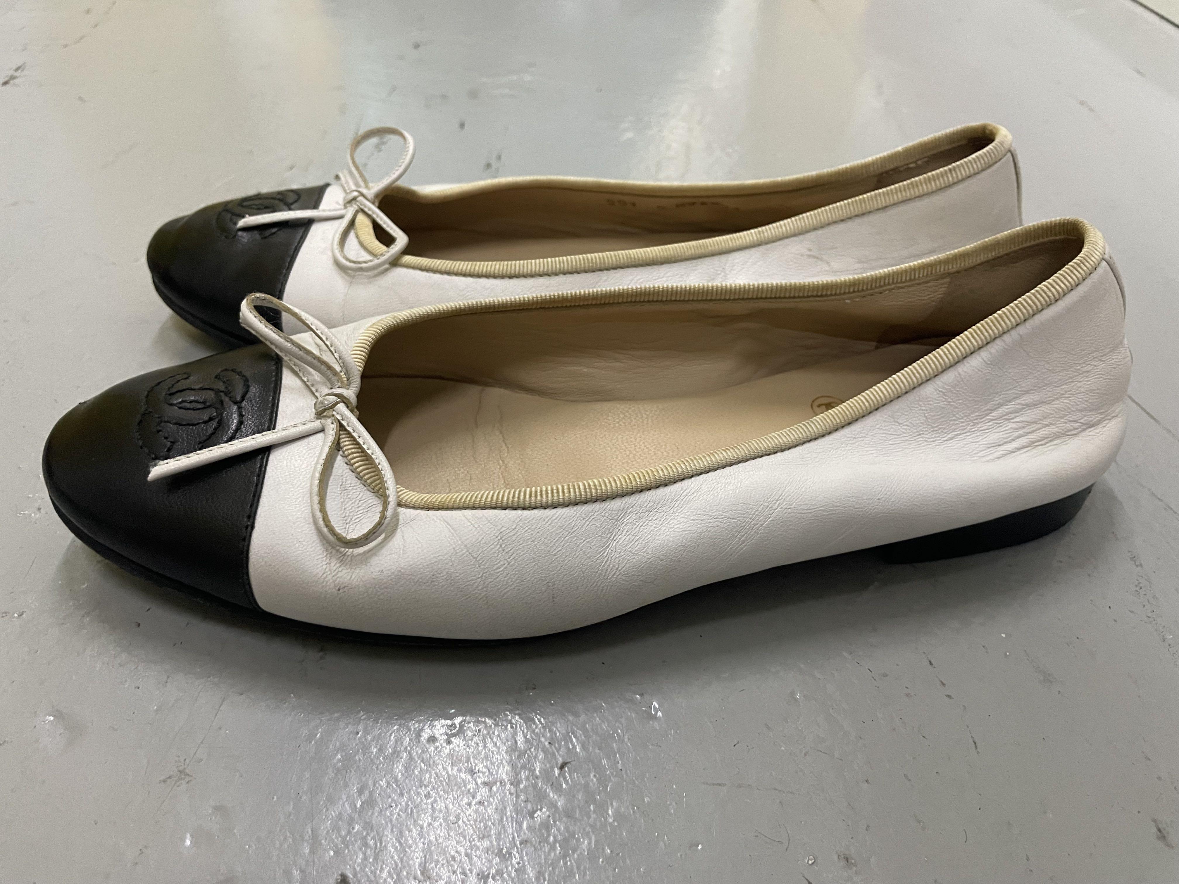 Chanel classic leather black and white flats with embossed logo detail ...