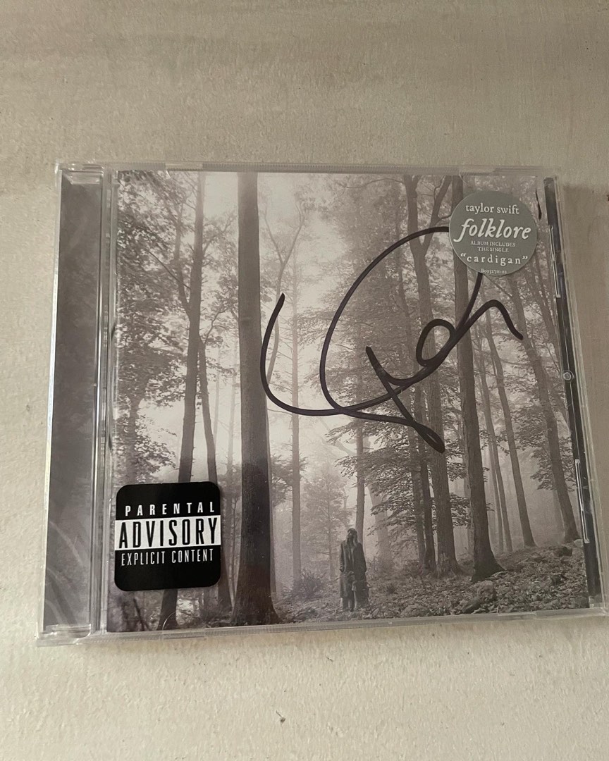 Signed Folklore In The Trees CD by Taylor Swift on Carousell