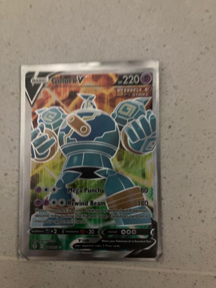 Golurk pokemon card with card holder, Hobbies & Toys, Toys & Games on ...