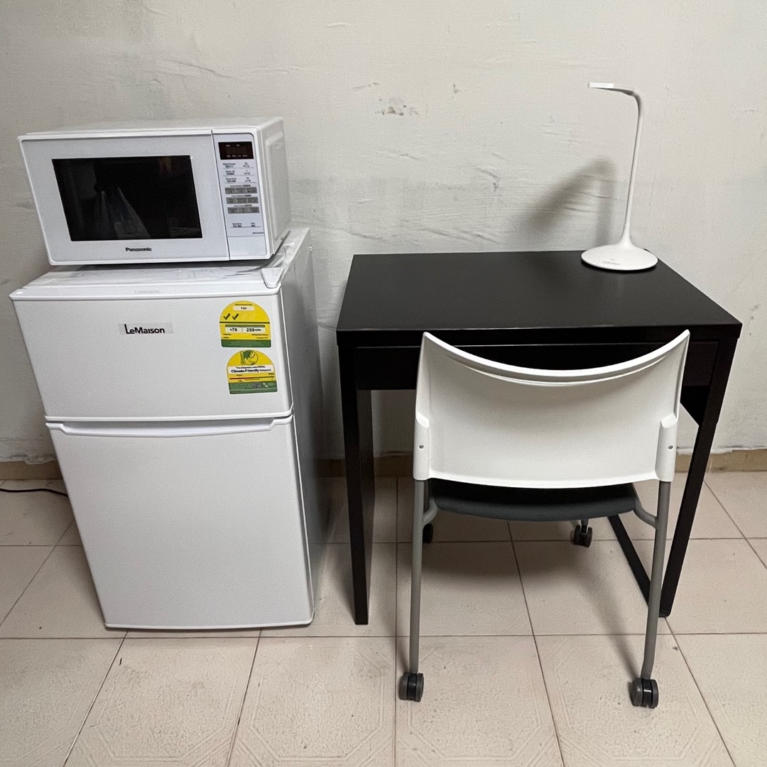 Desk assembled, chair with wheels, LED desk lamp, microwave, bar fridge ...