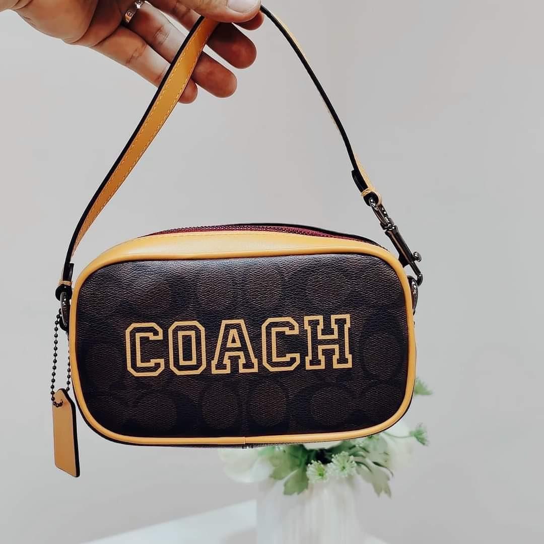 Coach Jamie Wrislet in Signature Canvas with Varsity Motif in Brown ...