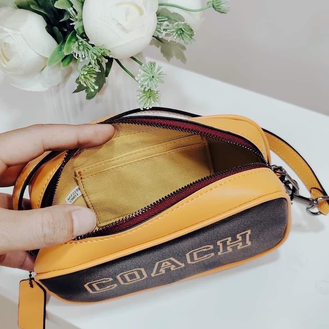 Coach Jamie Wrislet in Signature Canvas with Varsity Motif in Brown ...