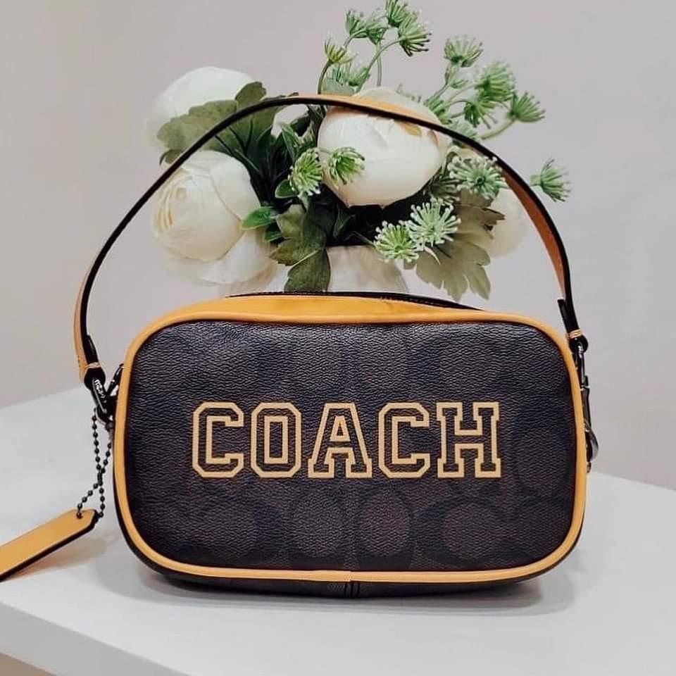 Coach Jamie Wrislet in Signature Canvas with Varsity Motif in Brown ...