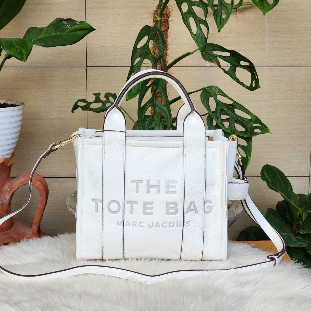 The Leather Tote Bag Debossed With The Signature Branding - White ...