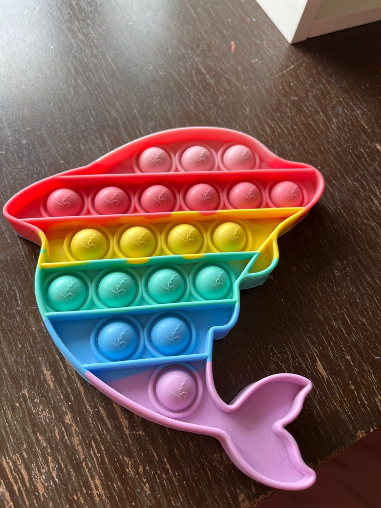 Rainbow dolphins pop it, Hobbies & Toys, Toys & Games on Carousell