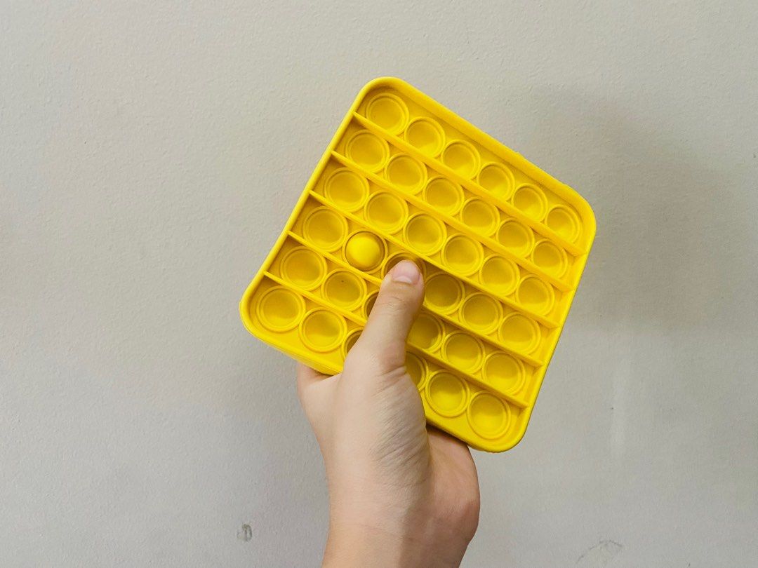 Yellow pop it fidget toy, Hobbies & Toys, Toys & Games on Carousell