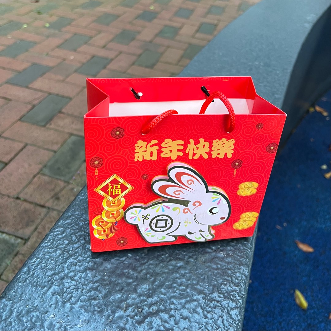 Free CNY orange carrier bag, Everything Else on Carousell