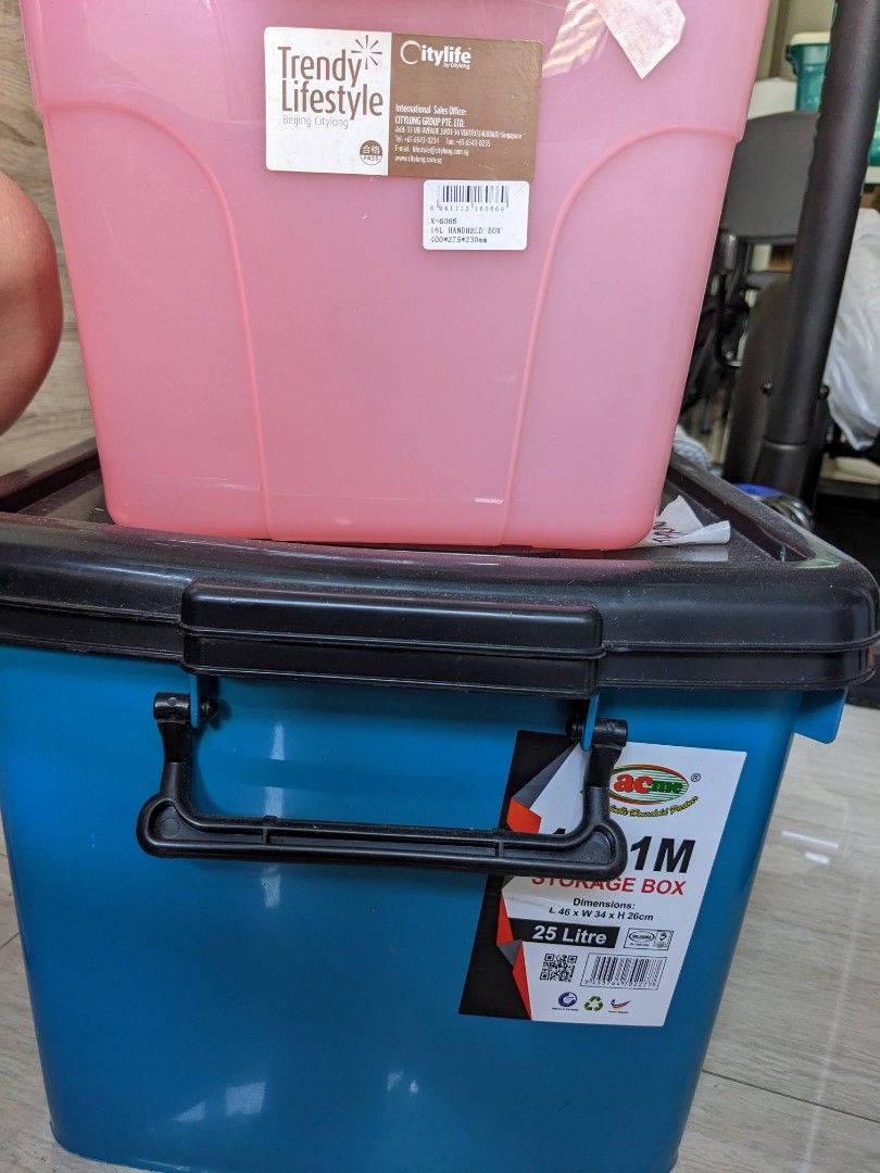 Assorted sturdy wheeled storage boxes opaque and translucent, Furniture ...