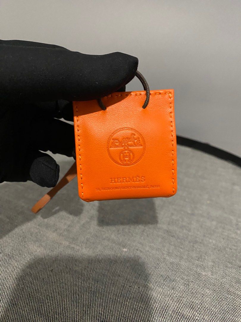 HERMES ORANGE PAPERBAG CHARM, Luxury, Accessories on Carousell