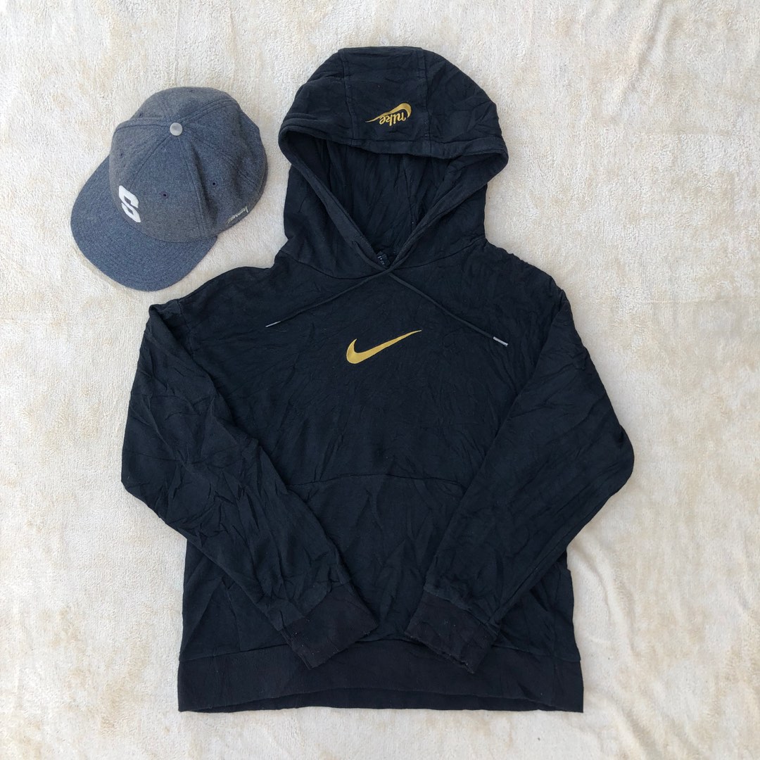 Nike swoosh gold, Men's Fashion, Coats, Jackets and Outerwear on Carousell