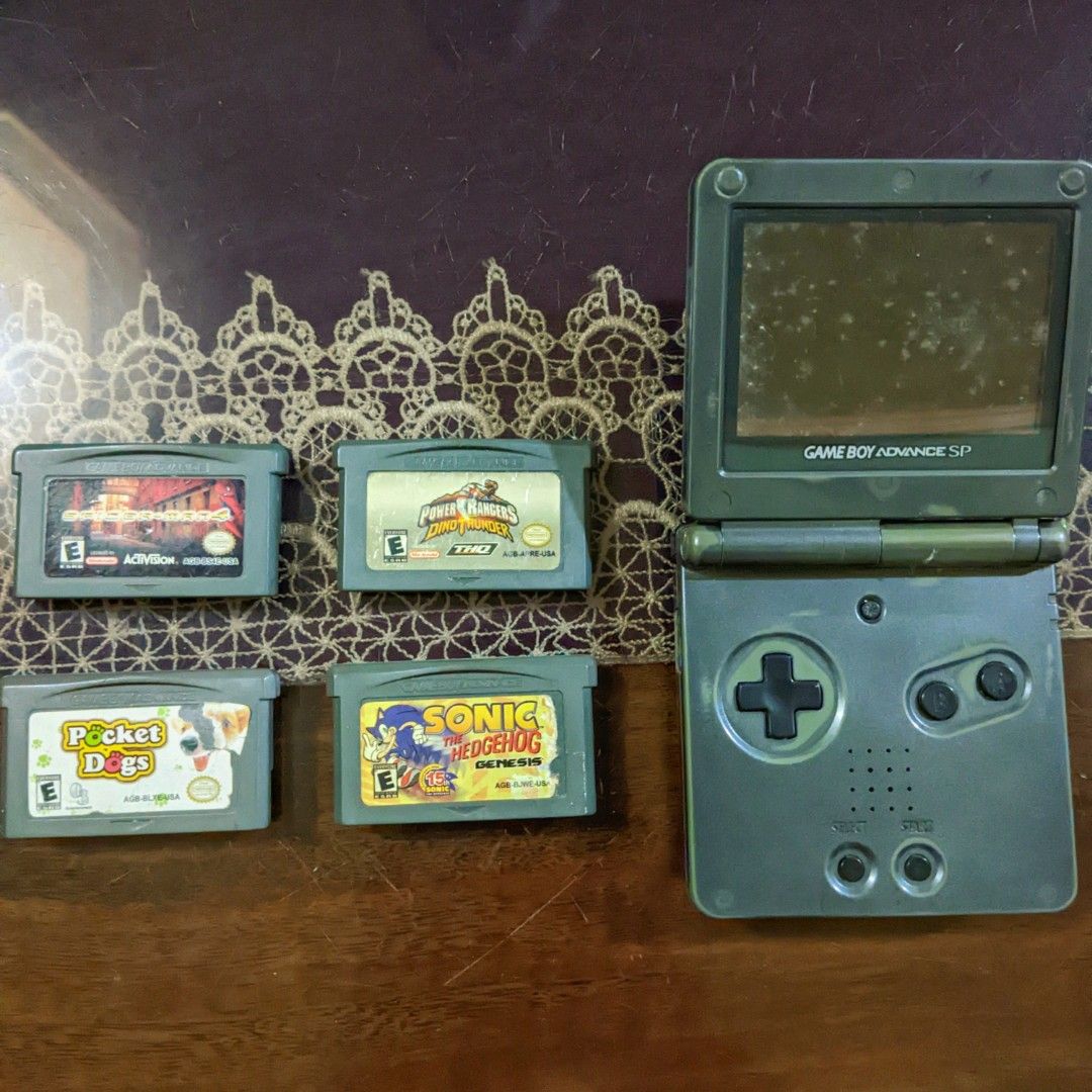 Gameboy advance Sp AGS-101 model (with games) on Carousell