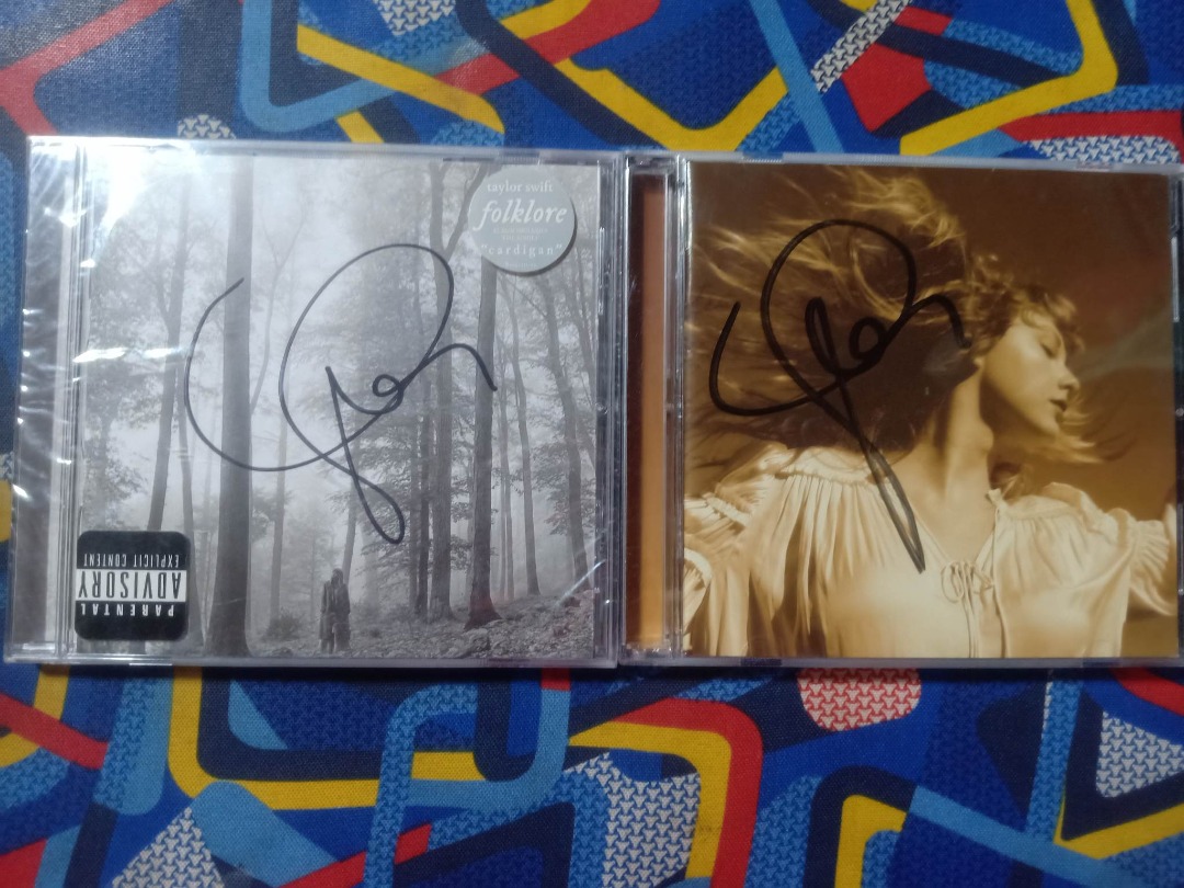 Taylor Swift Signed Folklore and Signed Fearless( Taylor Version) CD ... Taylor Swift Signed Folklore and Signed Fearless( Taylor Version) CD ...