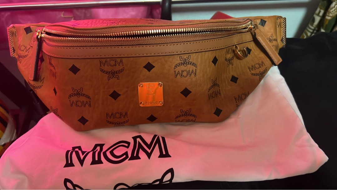 MCM pouch beg, Luxury, Bags & Wallets on Carousell