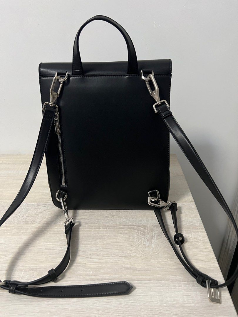 Charles and Keith front flap structured backpack, Women's Fashion, Bags ...