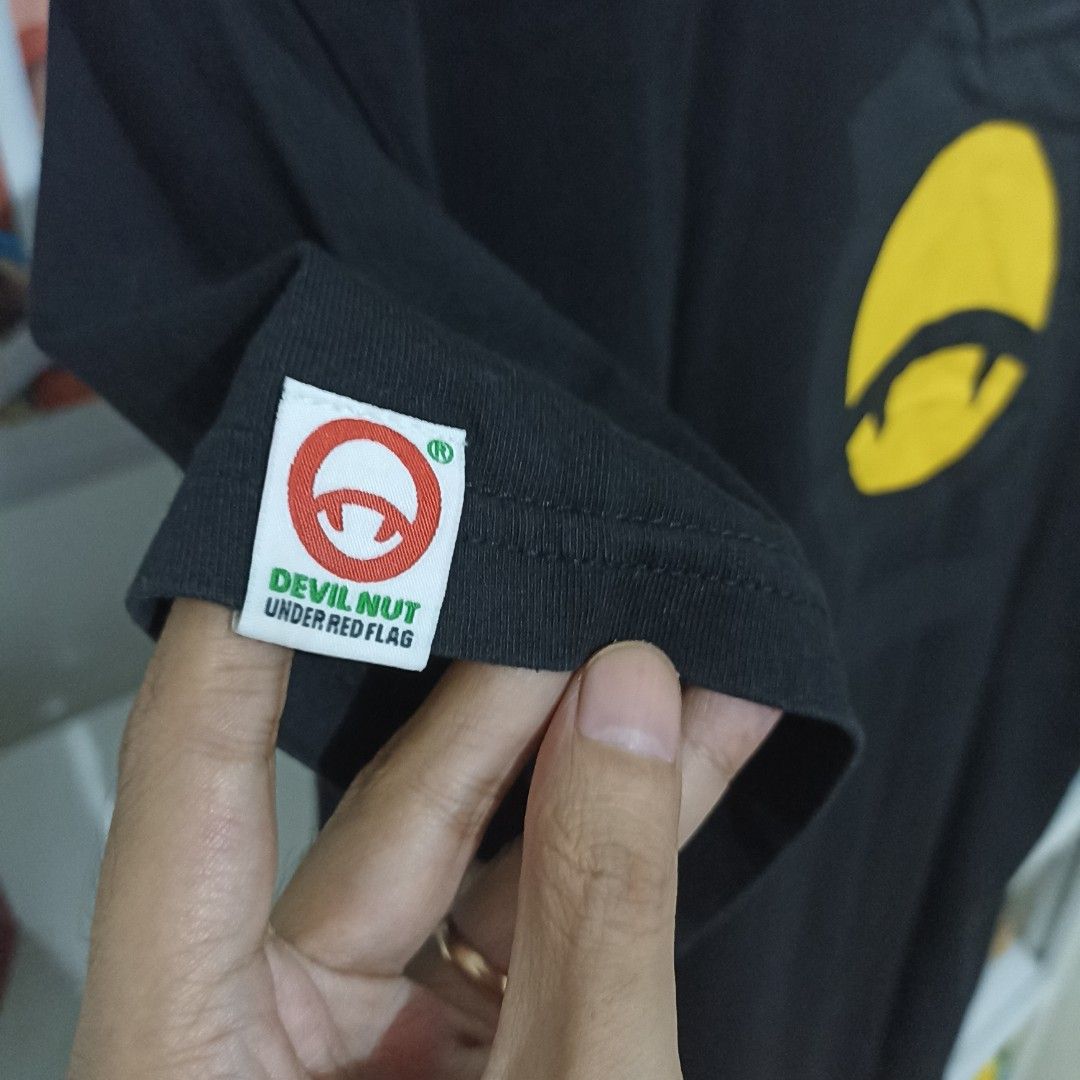 KAOS DEVIL NUT UNDER RED FLAG SECOND, Fesyen Pria, Pakaian , Atasan di Carousell