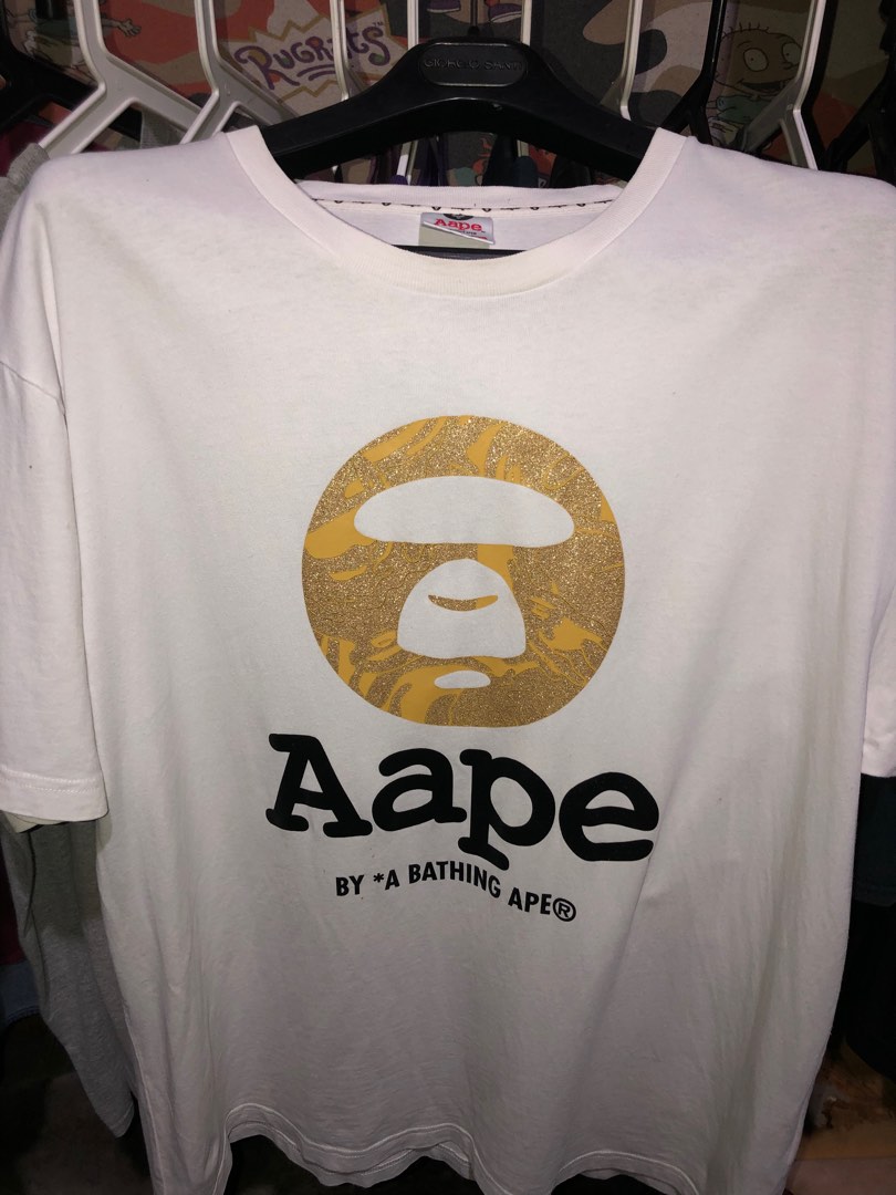 Aape Gold head logo, Men's Fashion, Tops & Sets, Tshirts & Polo Shirts on Carousell