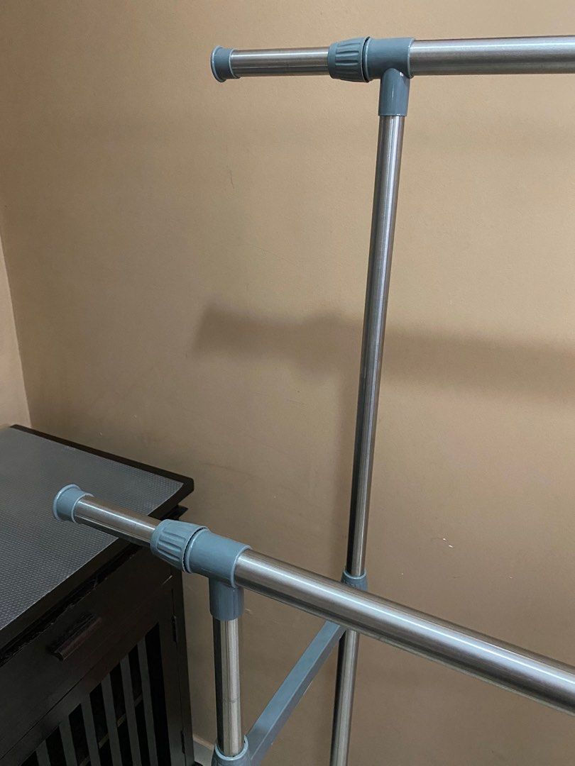 Extendable stainless steel cloth rack with locking wheels, Furniture ...