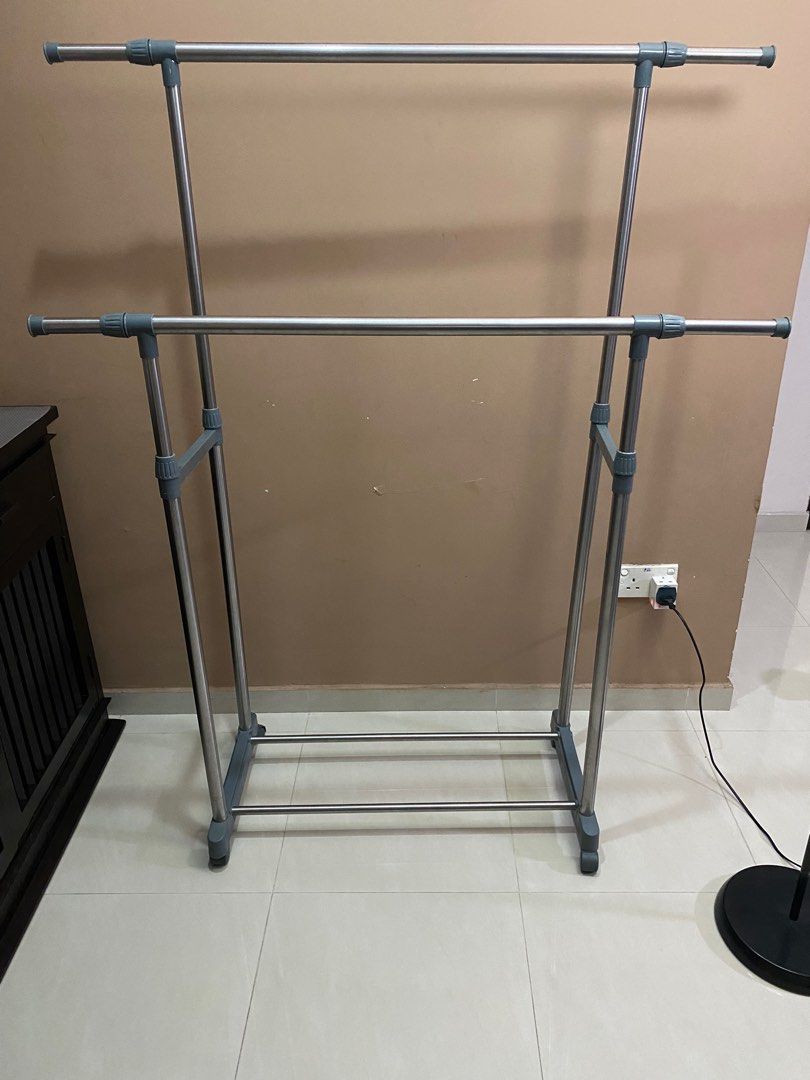 Extendable stainless steel cloth rack with locking wheels, Furniture ...