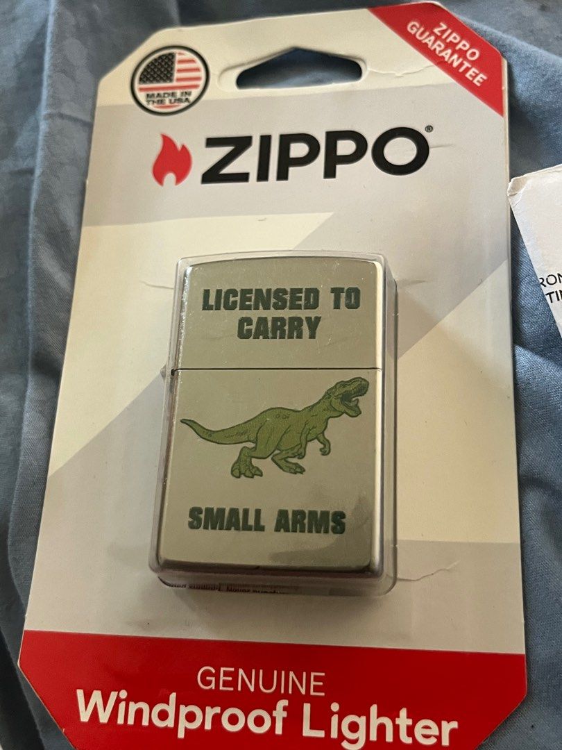 Zippo lighter T-Rex, Everything Else on Carousell