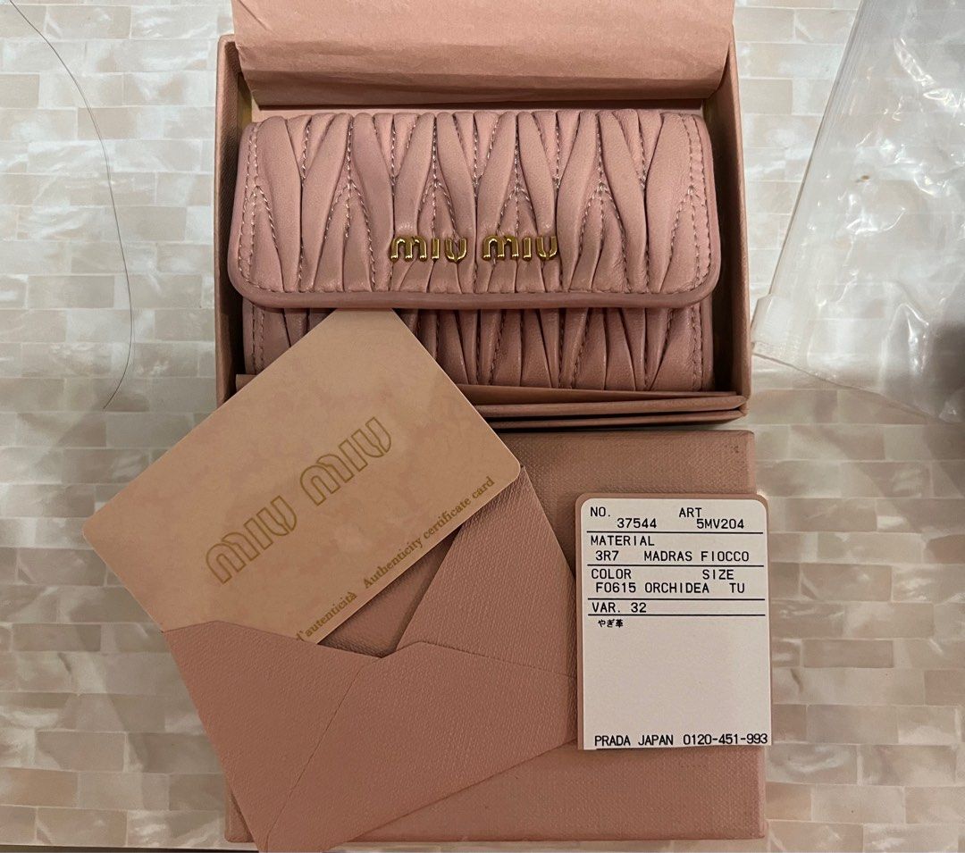 Miu Miu key & card holder, Women's Fashion, Bags & Wallets, Wallets & Card holders on Carousell