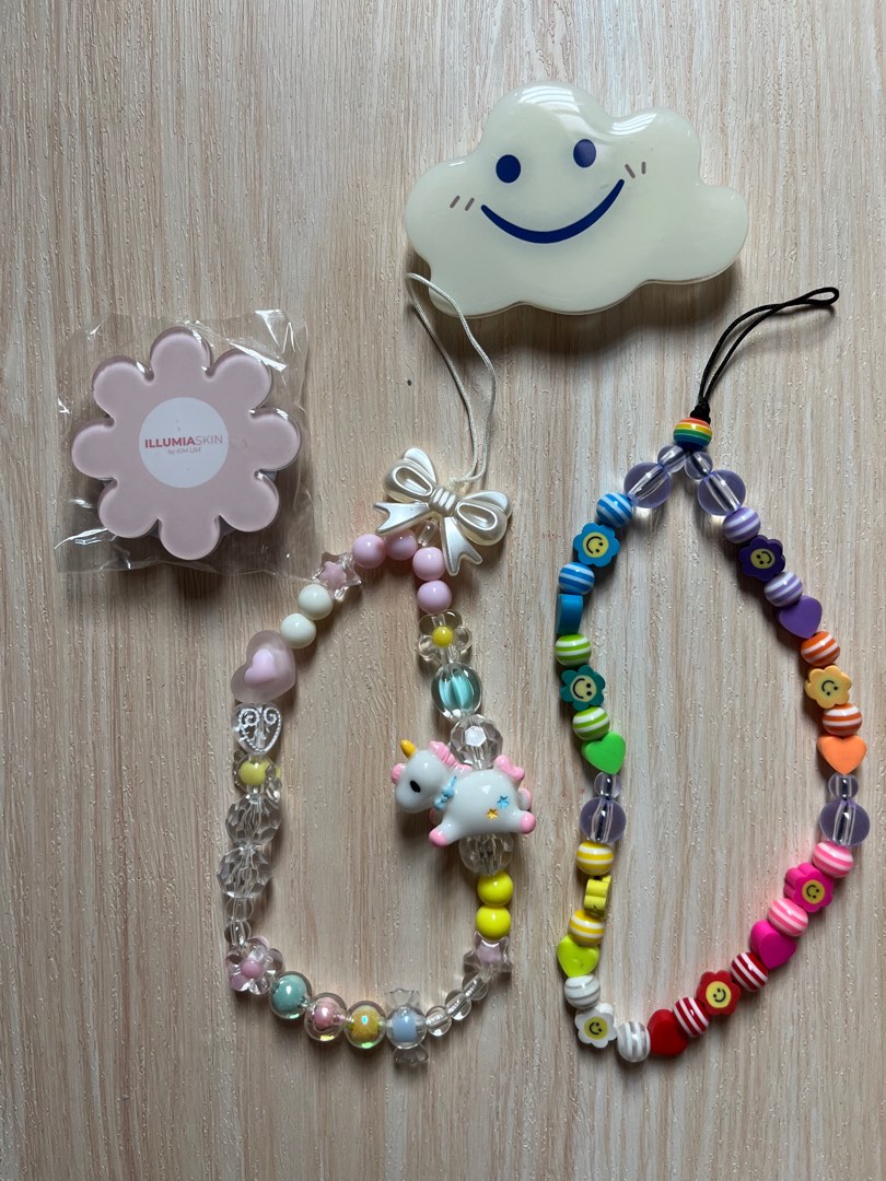 Mobile phone accessories: pop socket finger support, smiley face and ...