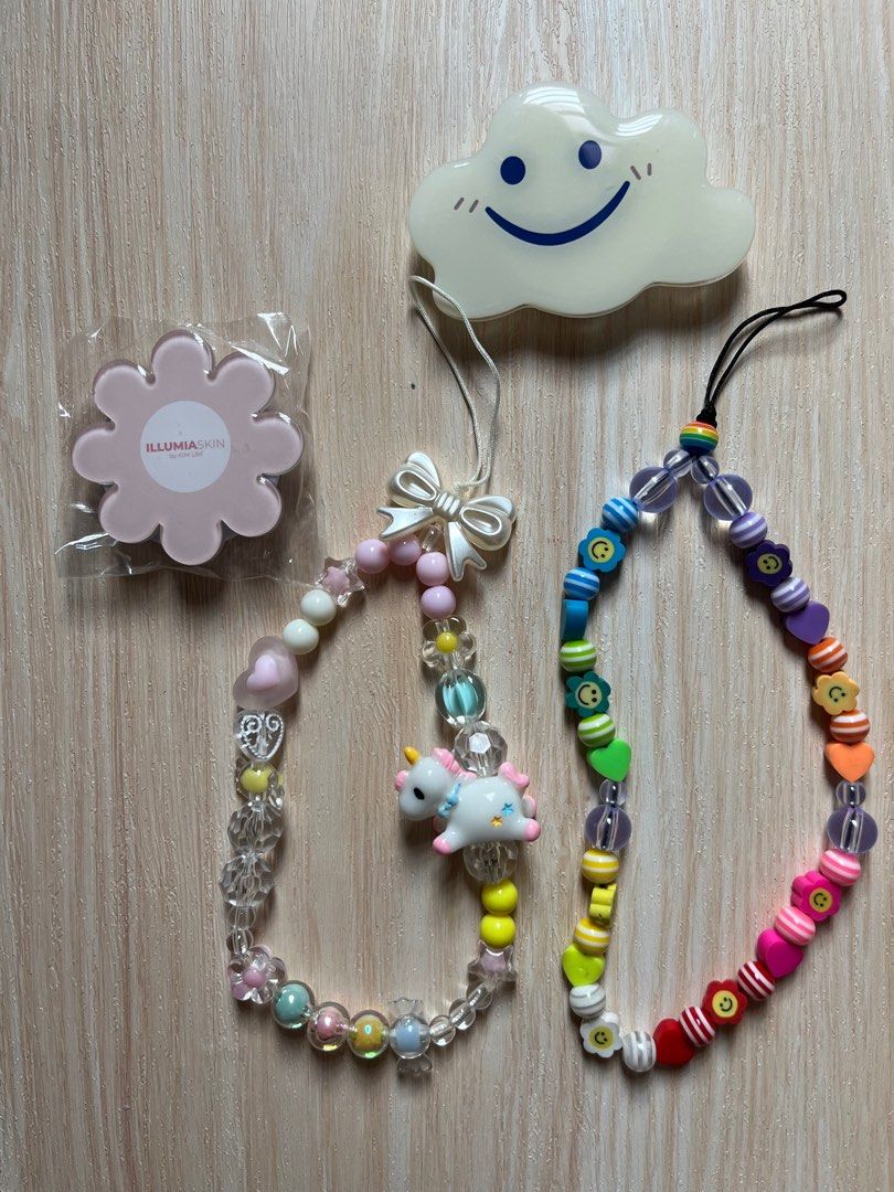 Mobile phone accessories: pop socket finger support, smiley face and ...