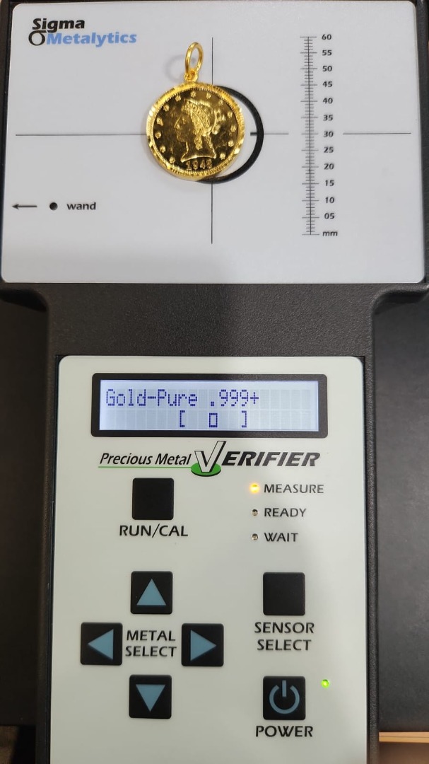 24k fine gold coin encased in a 24k gold pendant (14.54 grams, total ...