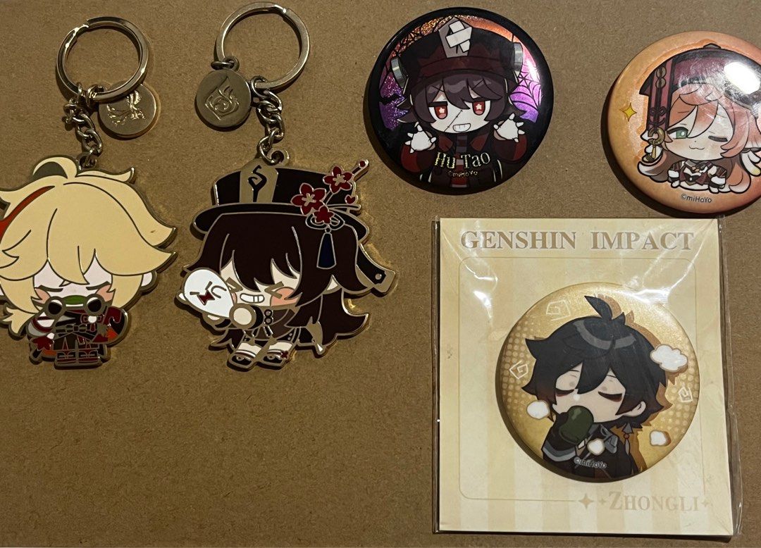 WTS Genshin impact official merch keychains and badges hutao zhongli ...