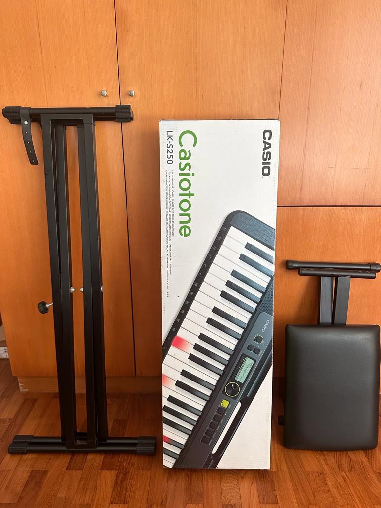 Casiotone portable keyboard LK-S250 with box. Comes with stand and ...